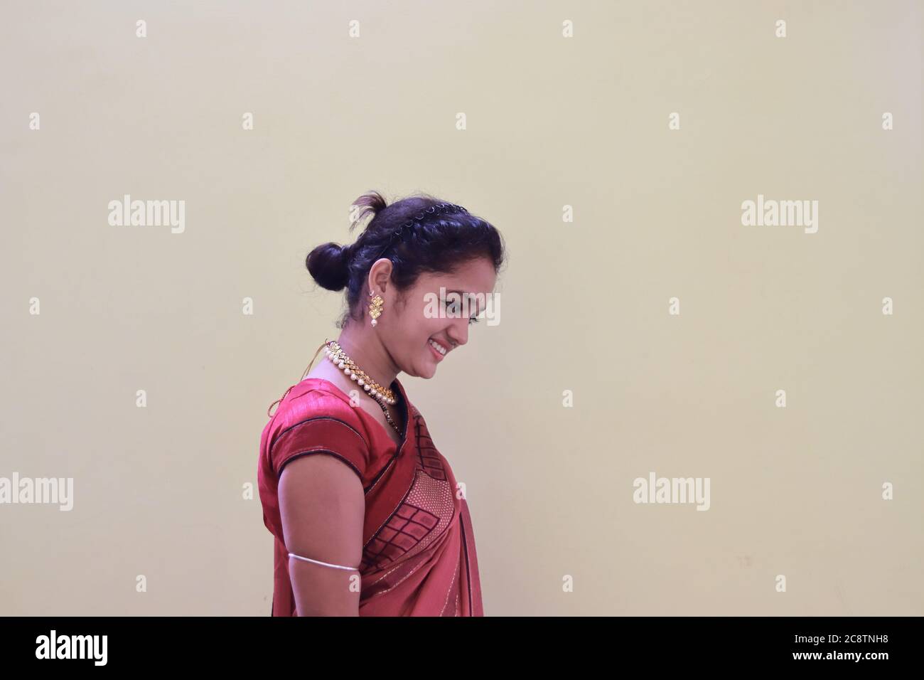 A model woman in a sari dressed in her customs and religion on white ...
