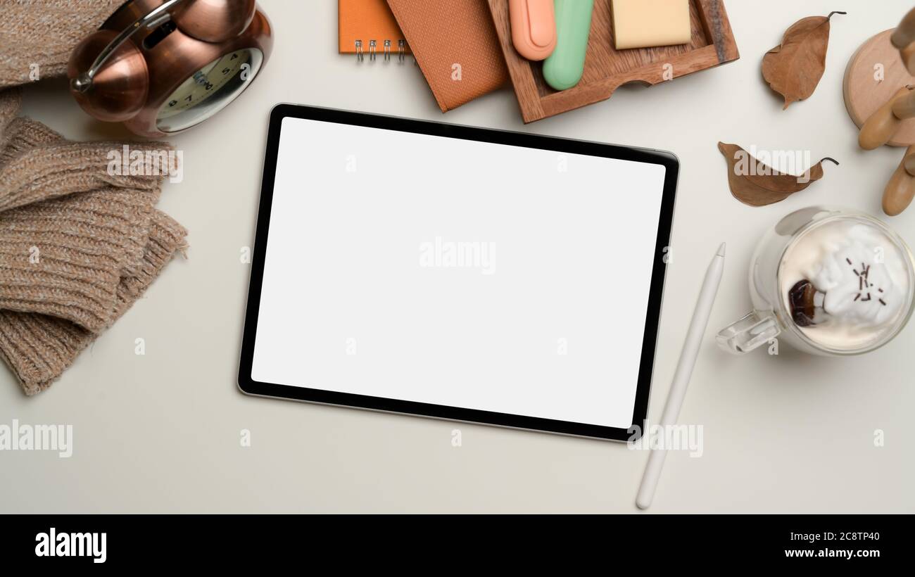 Top view of study table with digital tablet, stationery, cup of ...