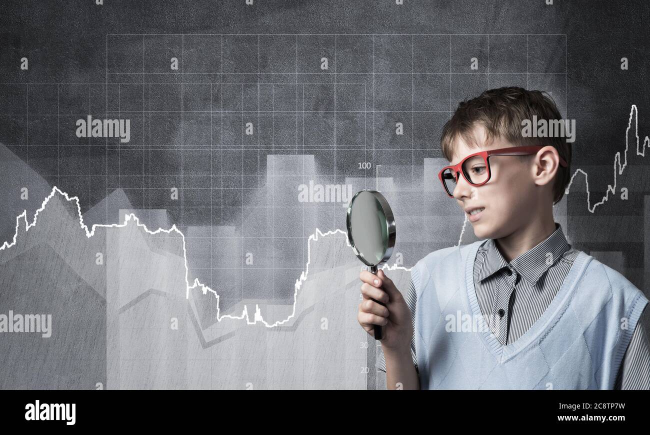 Curious school boy with magnifier Stock Photo - Alamy