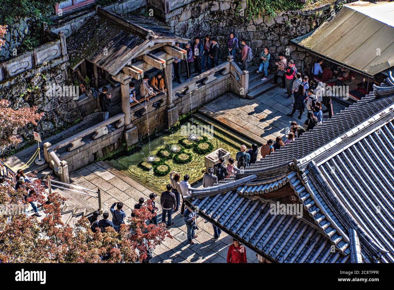 Pilgrims and tourists drinking from the Otowa-no-Taki waterfall holy ...
