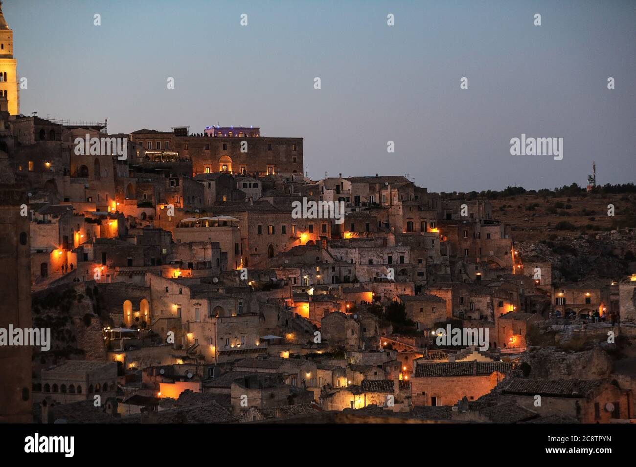 Amazing lighted buildings in ancient Sassi district by night in Matera ...