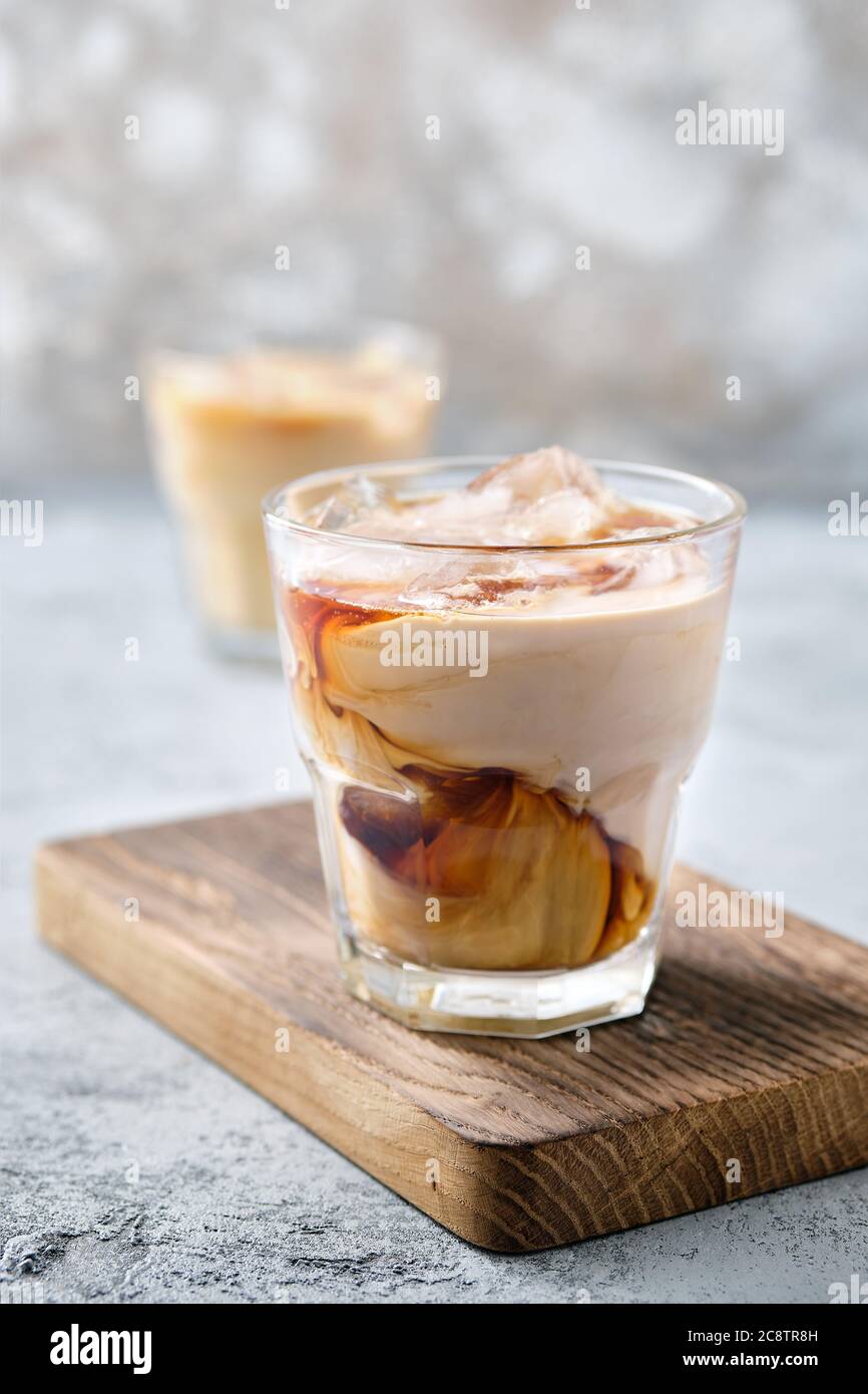 Iced coffee with fat cream in rocks glass Stock Photo - Alamy
