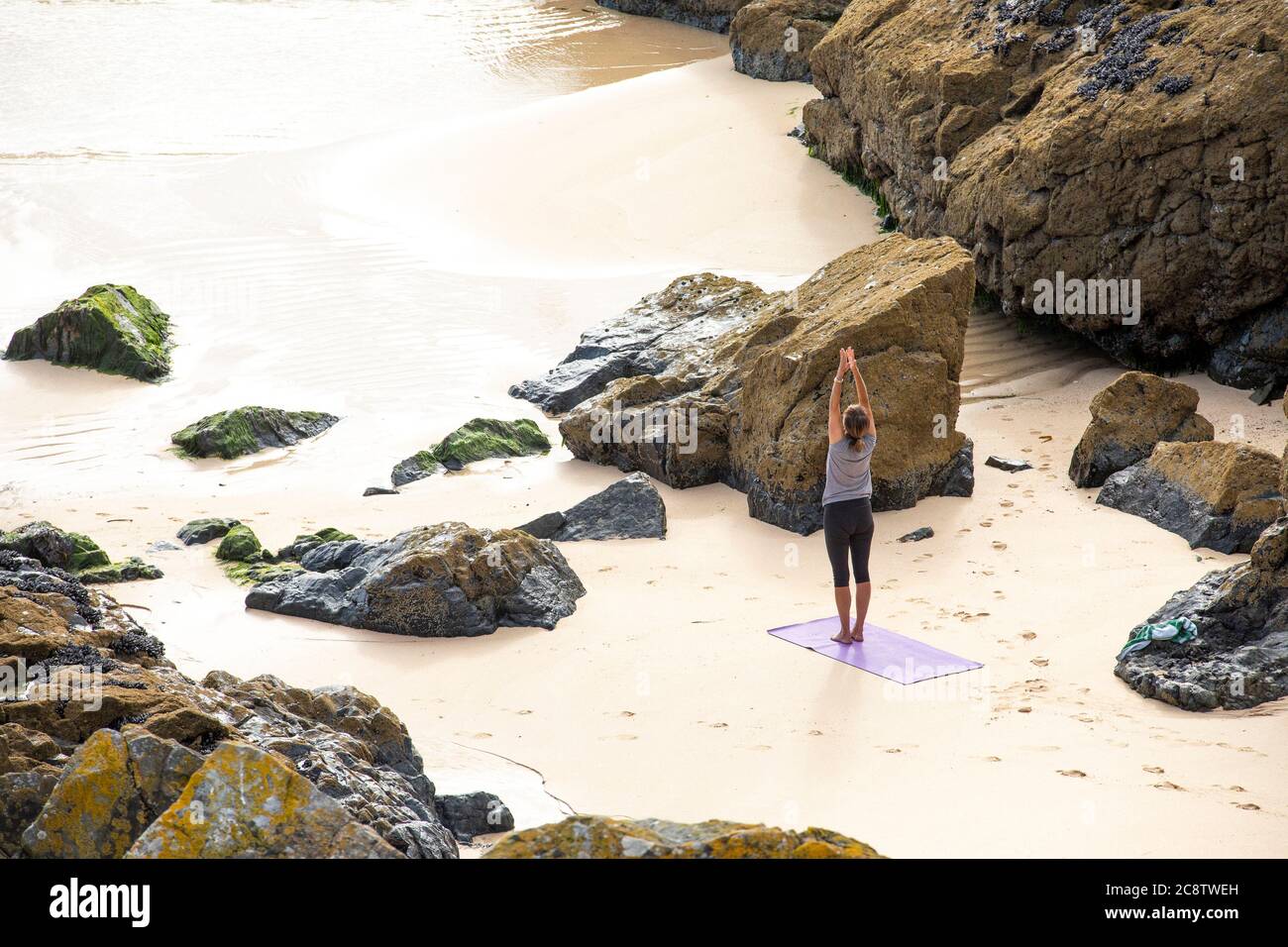 Yoga on a beach Stock Photo - Alamy