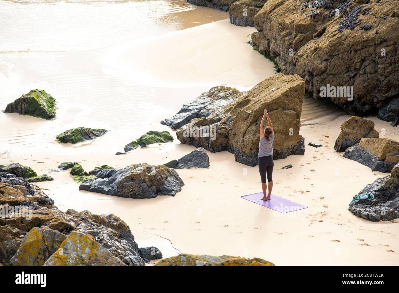 Yoga on a beach Stock Photo - Alamy