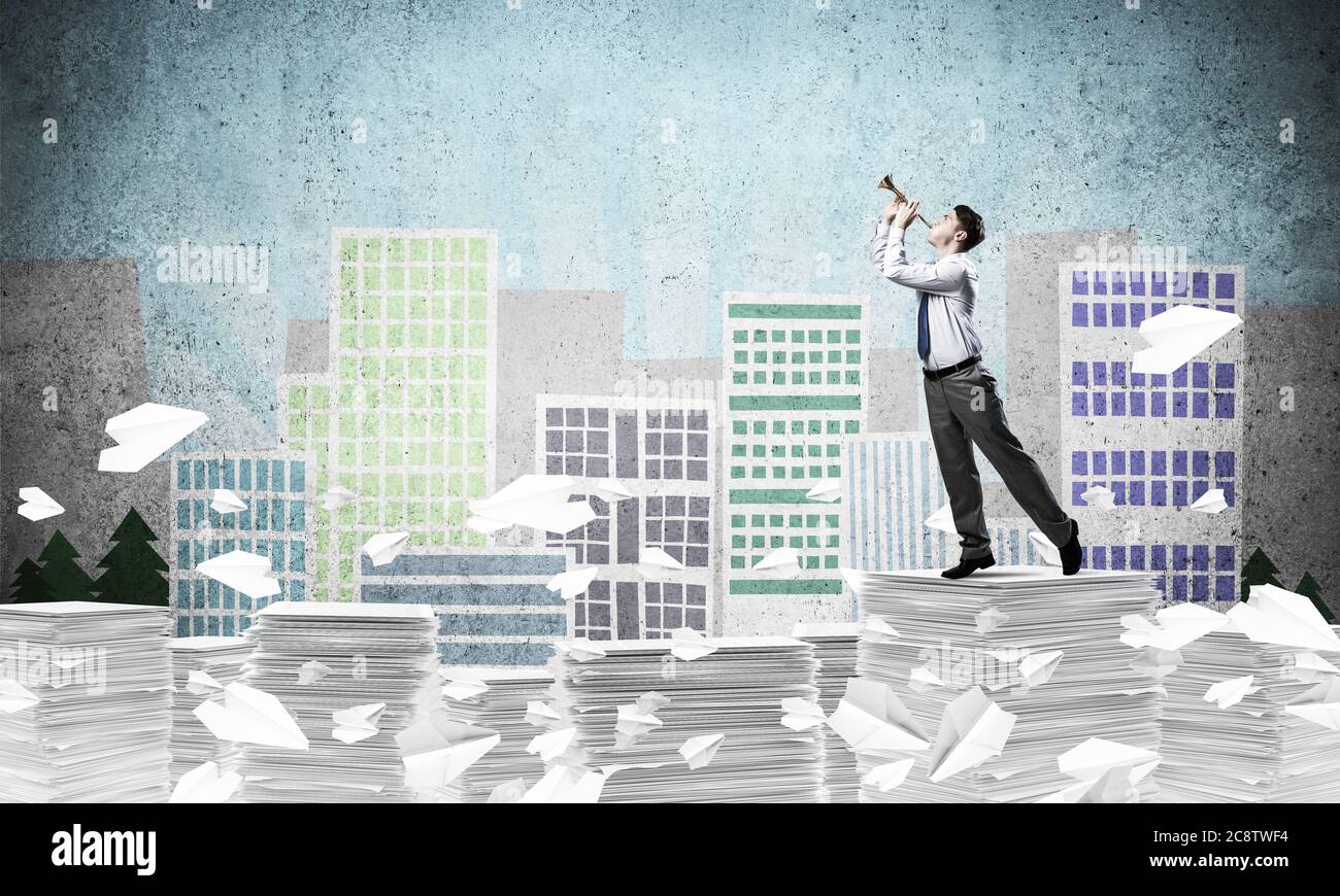 Happy businessman playing fife Stock Photo - Alamy
