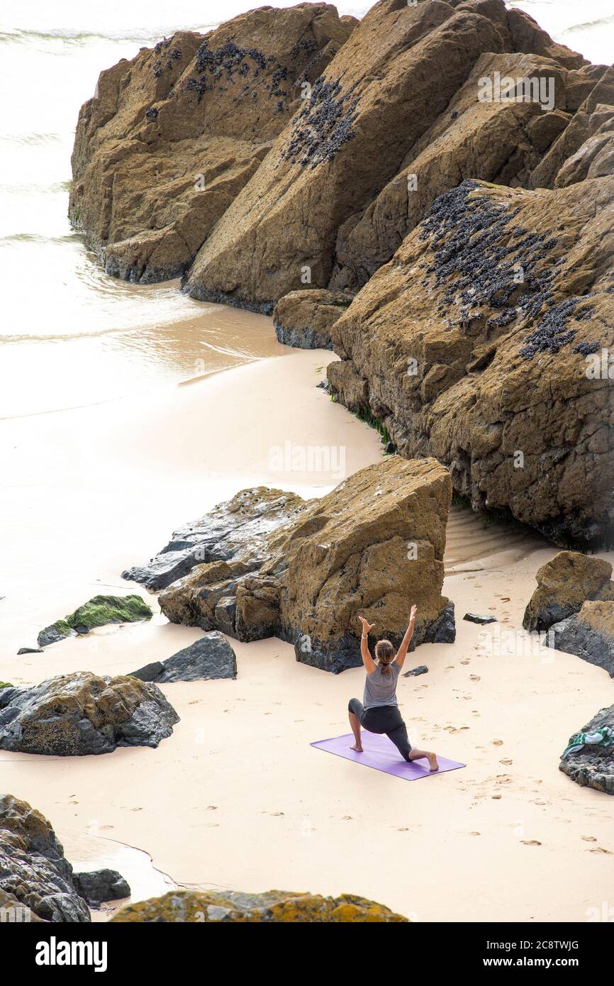 Yoga on a beach Stock Photo - Alamy