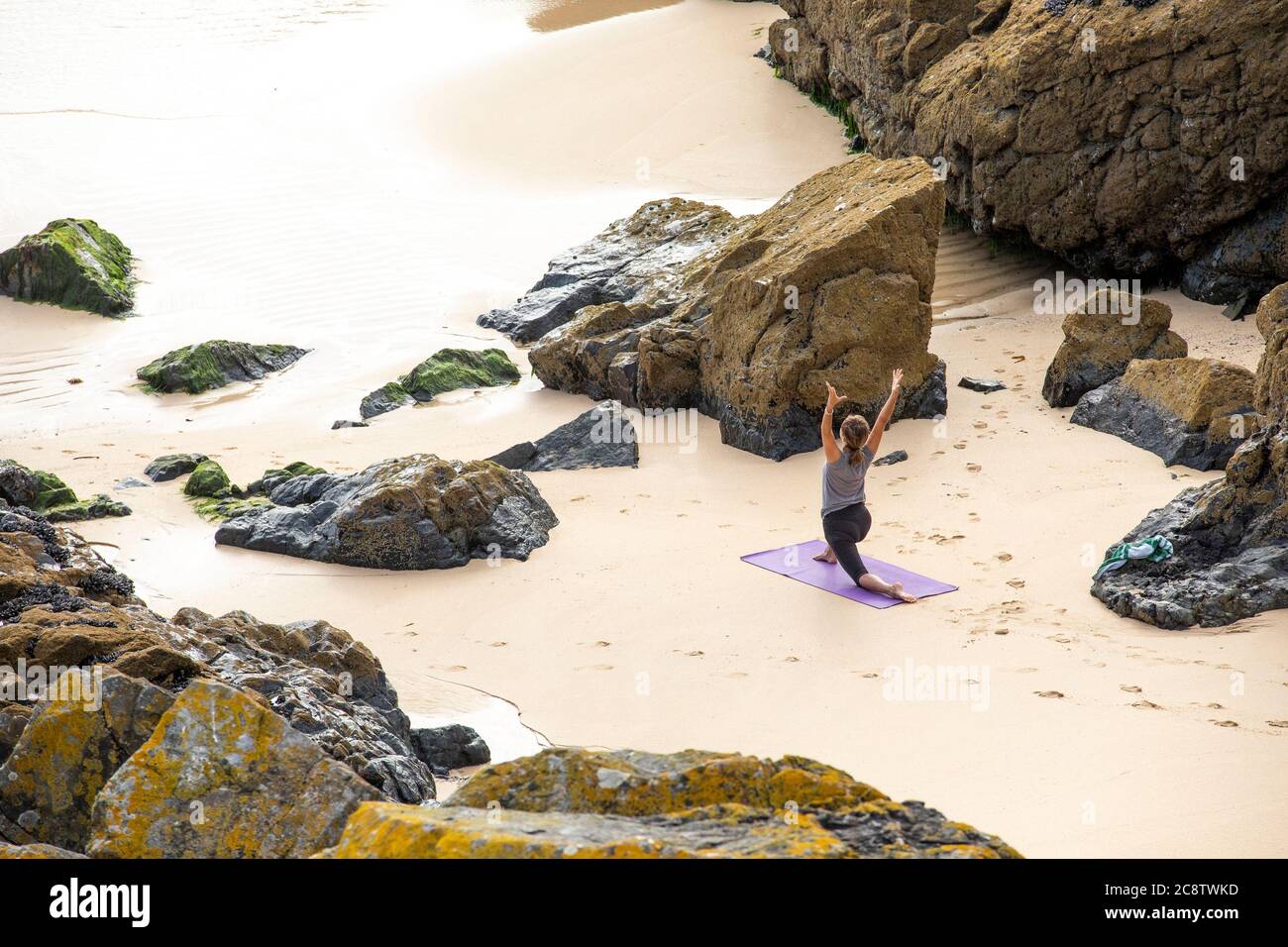 Yoga on a beach Stock Photo - Alamy