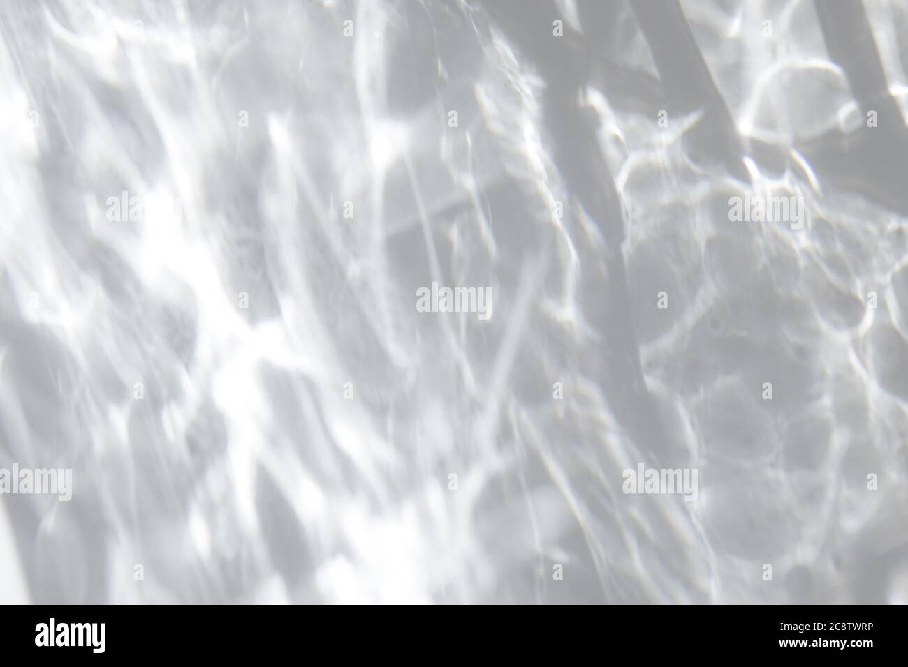 shadow and light caustic effect on a white wall Stock Photo - Alamy