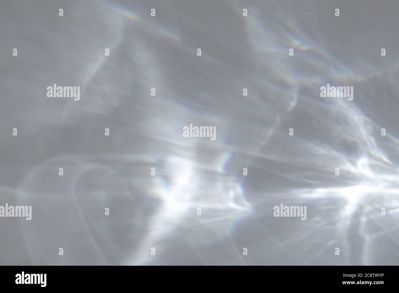 shadow and light caustic effect on a white wall Stock Photo - Alamy