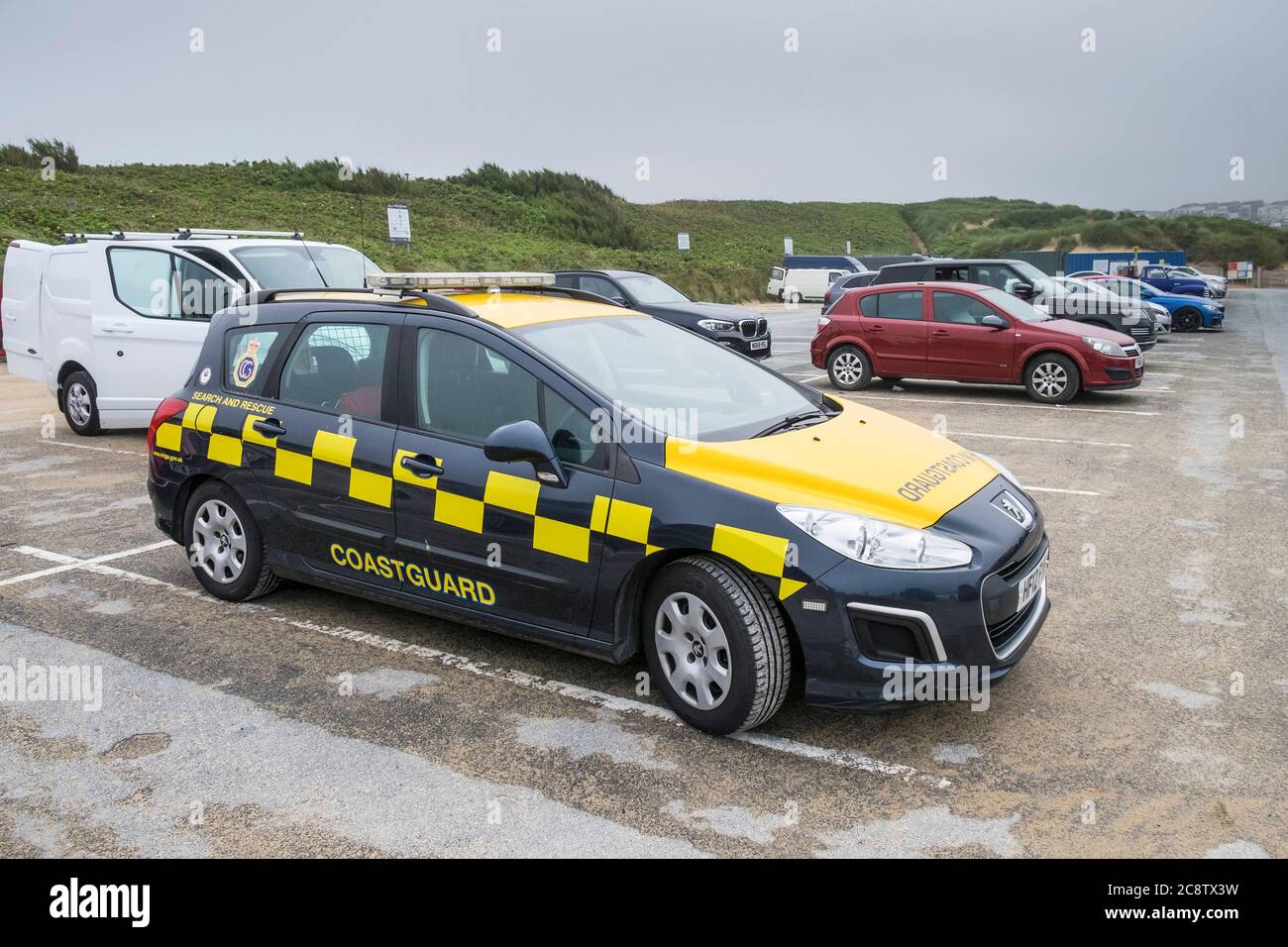 A Coastguard vehicle parked in Fistral Car Park in Cornwall Stock Photo ...