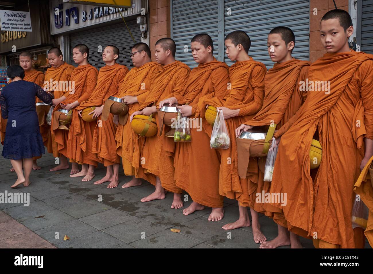 Novice monks of Wat Mahathat in Bangkok, Thailand, during their ...
