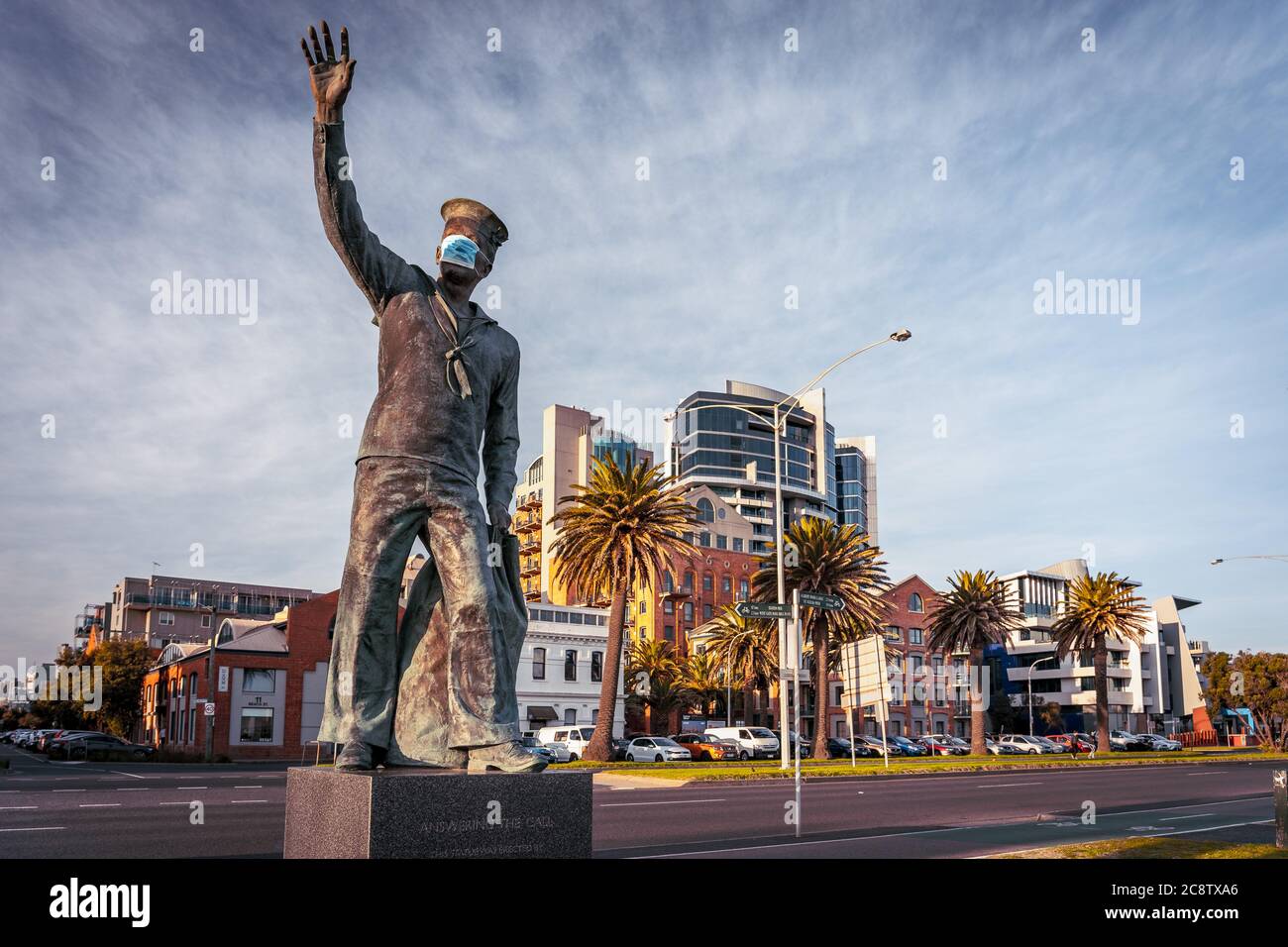 Melbourne, Australia - Statue in Port Melbourne with face mask on put ...