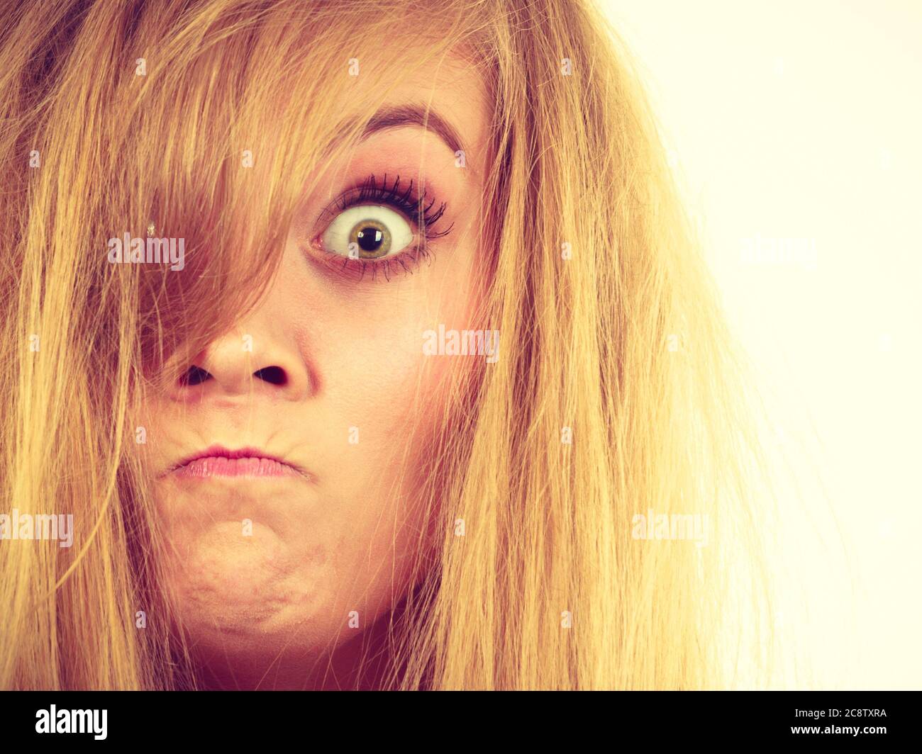 Emotions, face expression concept. Furiously mad angry blonde woman ...