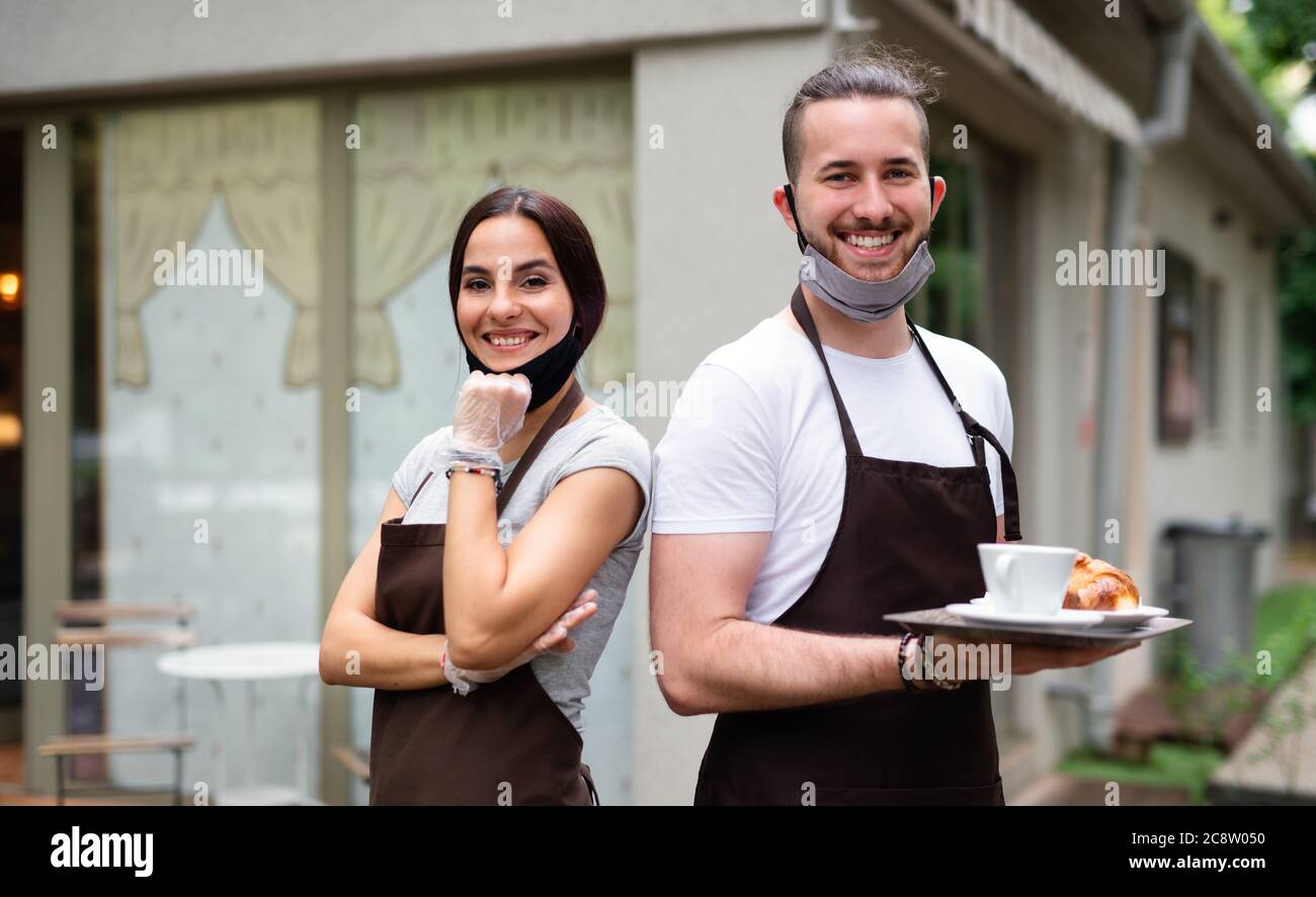 Waitress waiter holding tray in hi-res stock photography and images - Alamy