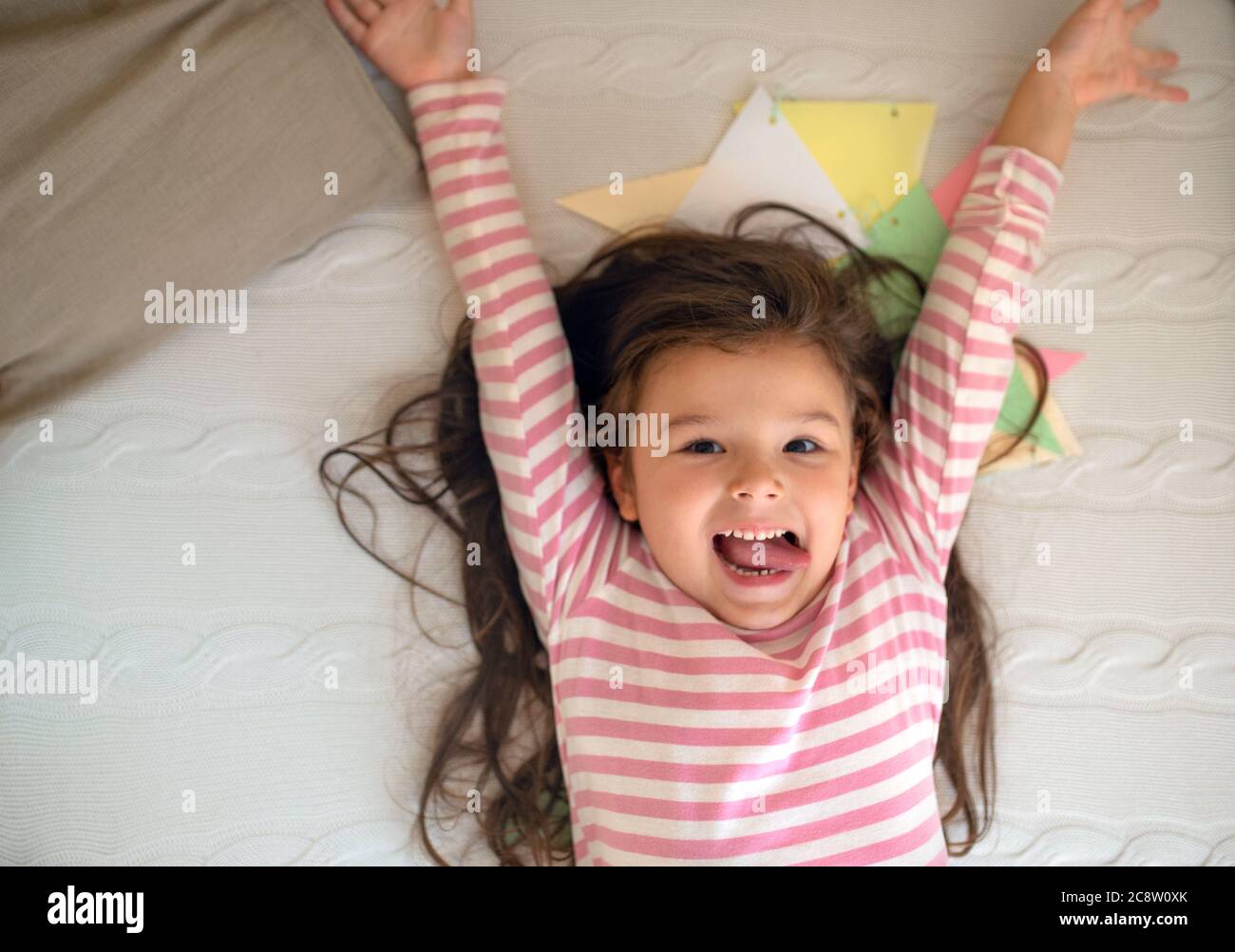 Top view portrait of small girl indoors, looking at camera Stock Photo ...