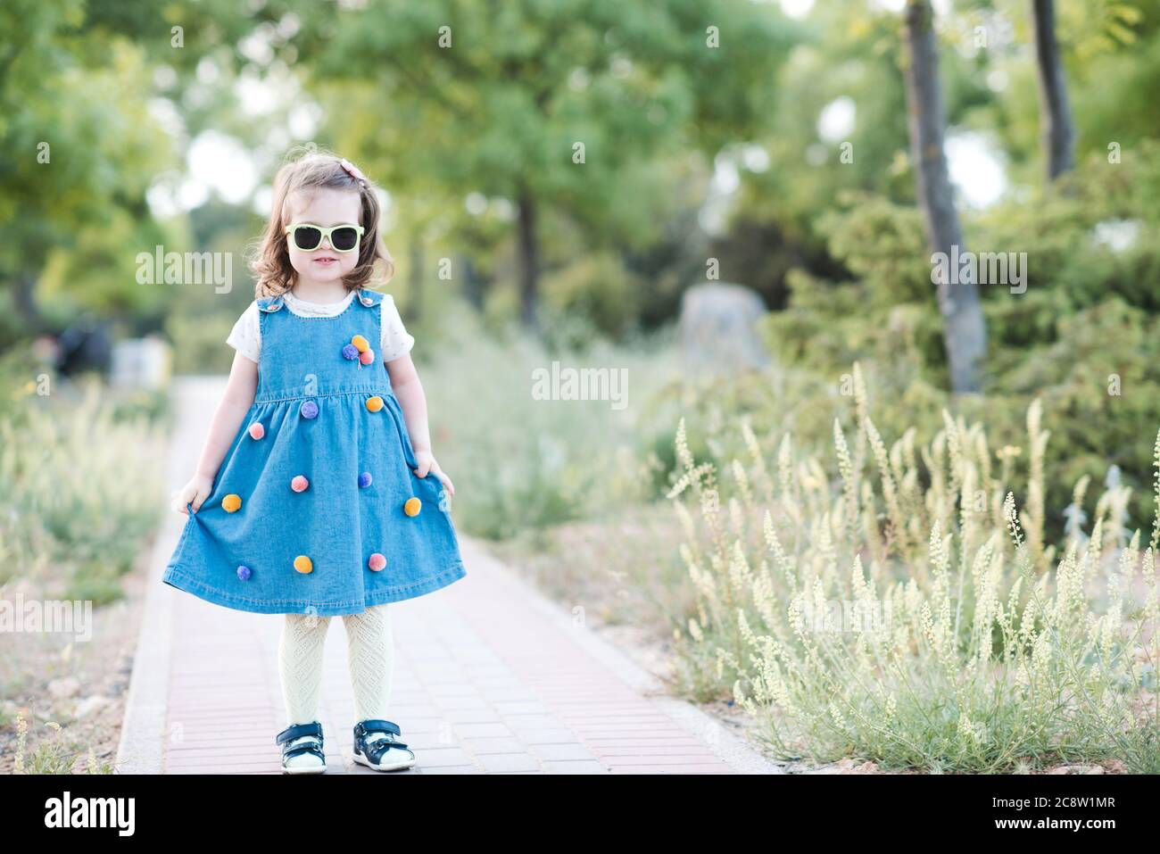 Sweet baby girl 2-3 year old walking in park closeup. Childhood. Summer ...