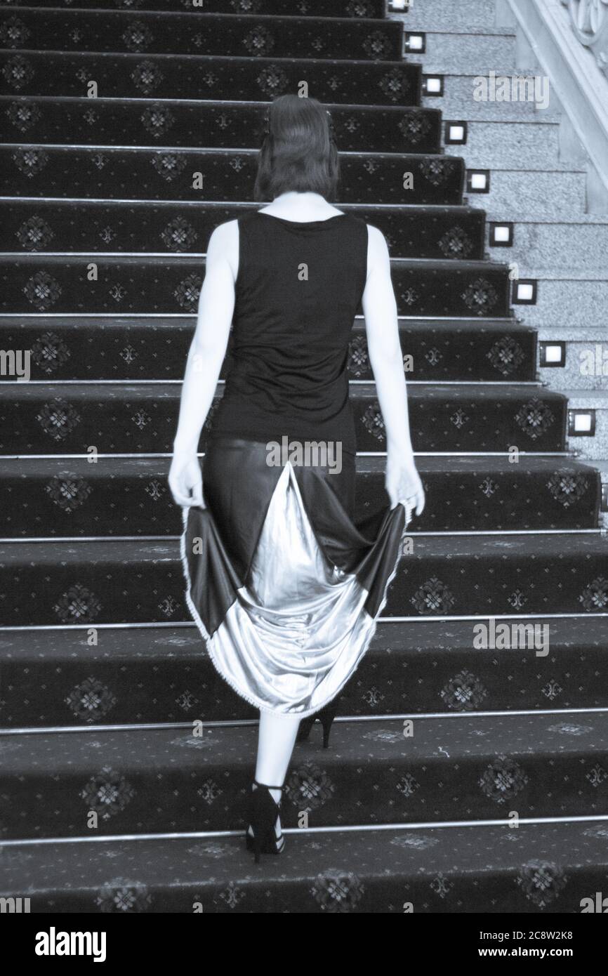 Legs of dancer woman climbing stairs. Mistery scene Stock Photo - Alamy