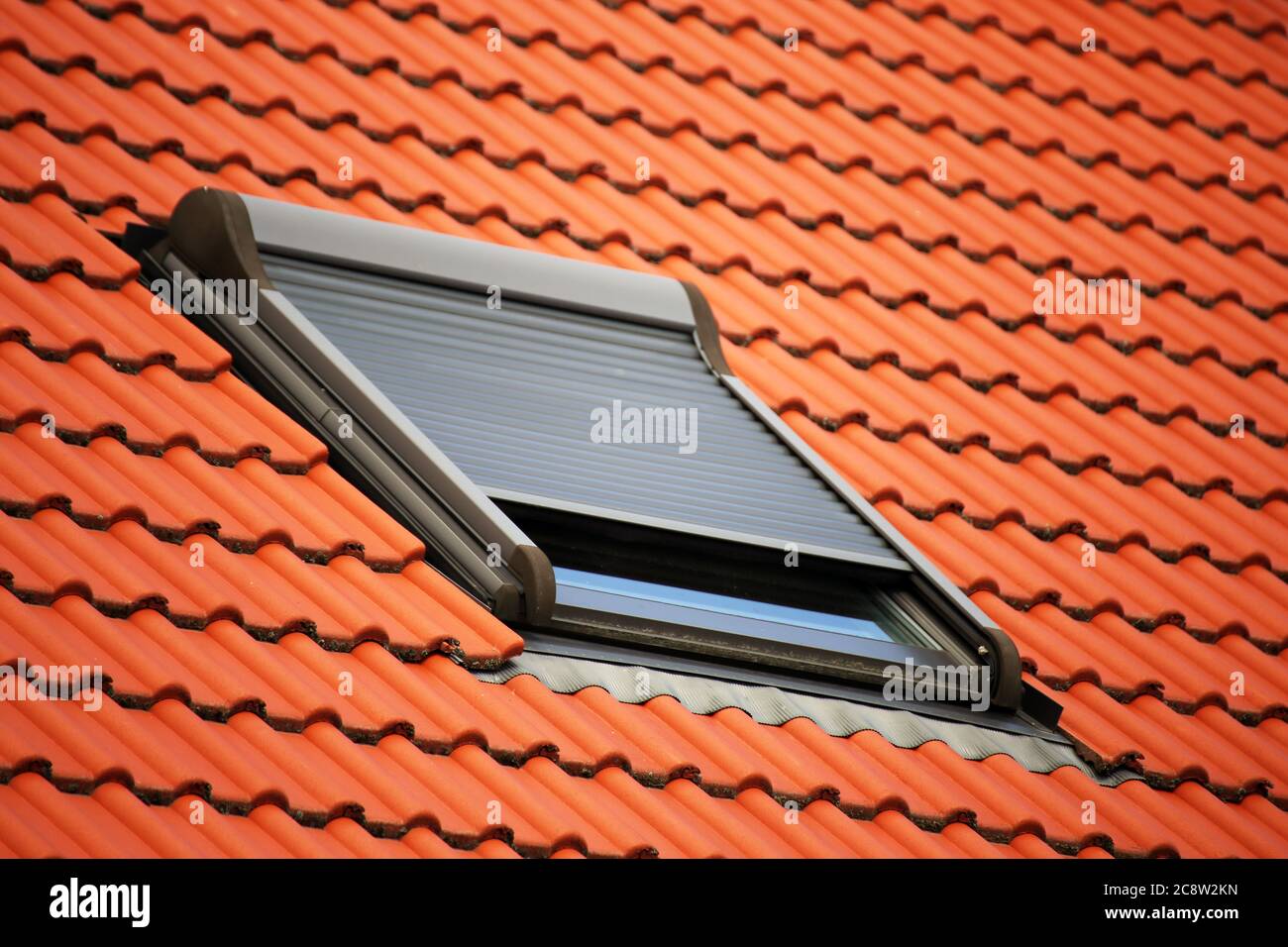 Roof window with roller shutter Stock Photo - Alamy