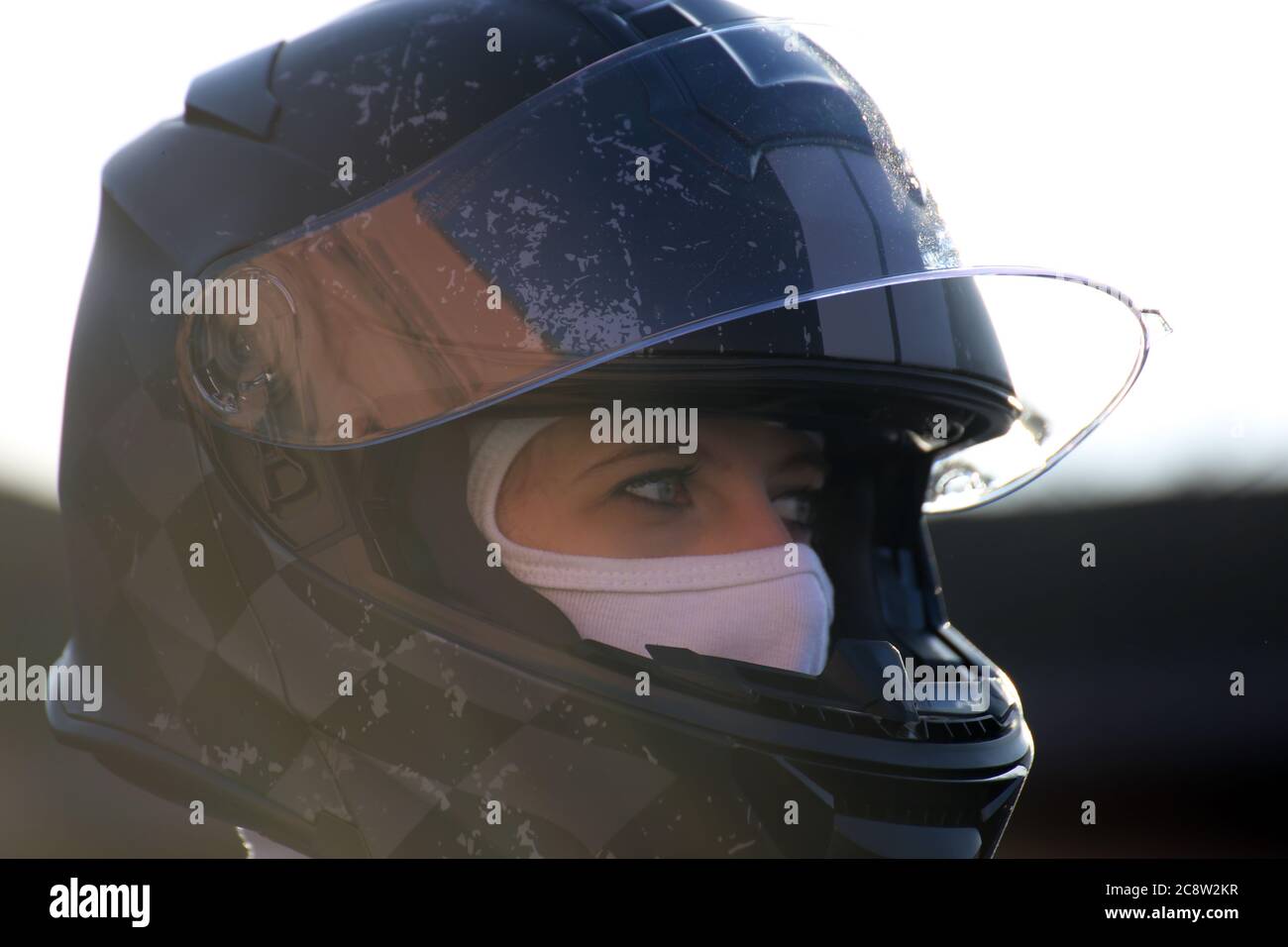 Symbol image: Female race car driver wears helmet and balaclava (Model ...