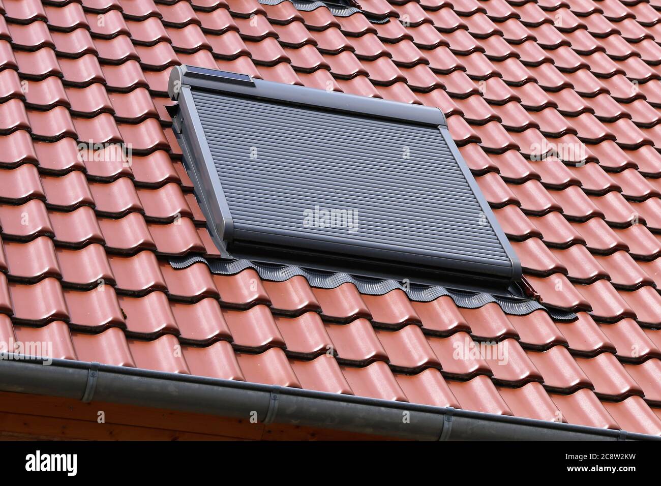 Roof window with roller shutter Stock Photo - Alamy