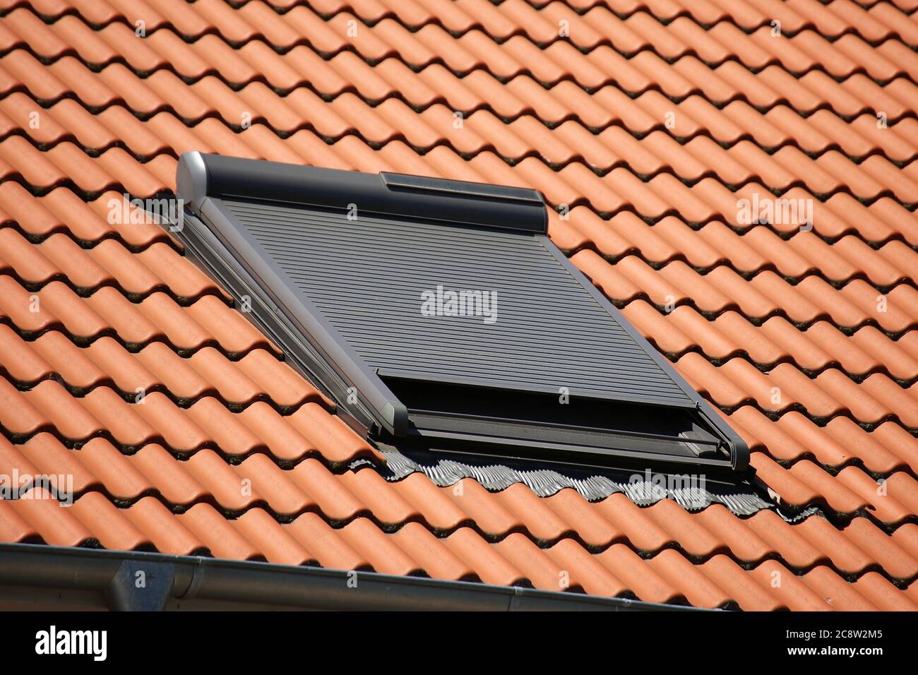 Roof window with roller shutter Stock Photo - Alamy