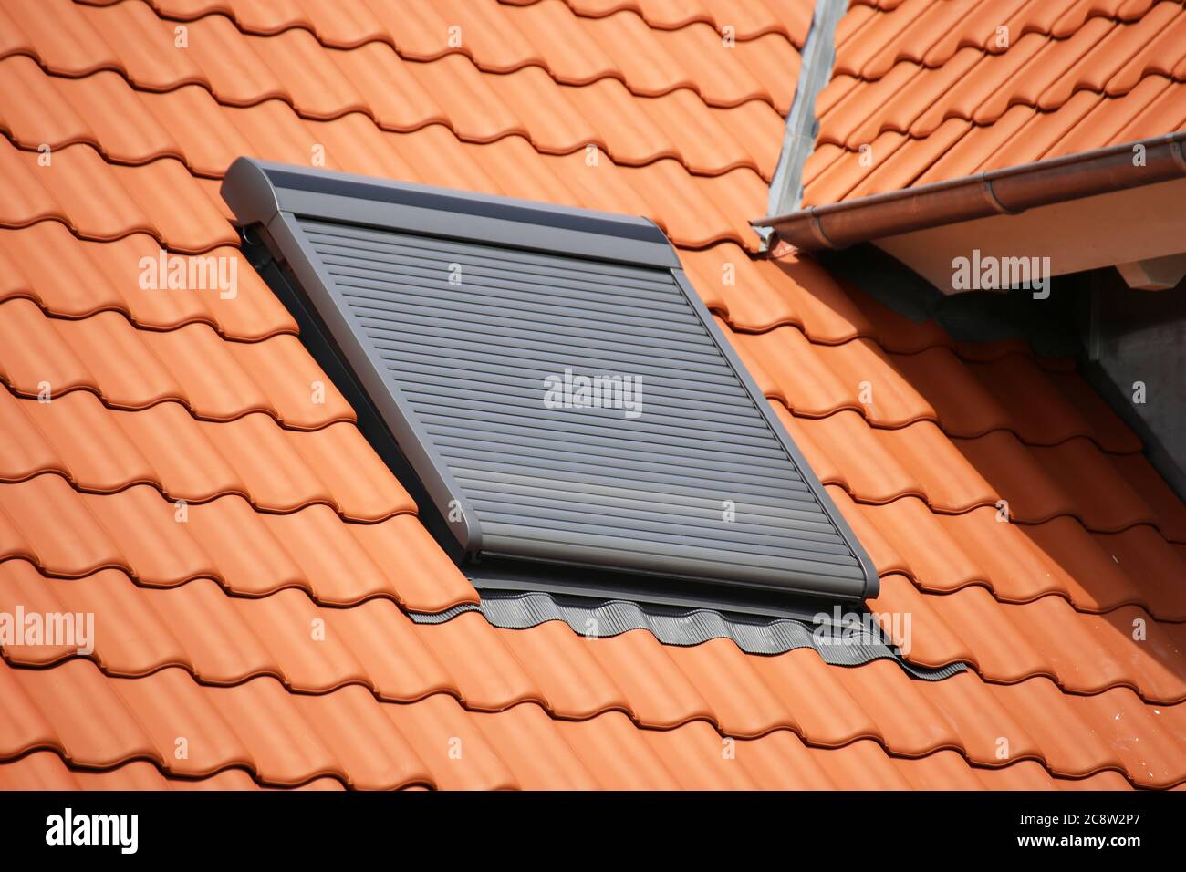 Roof window with roller shutter Stock Photo - Alamy