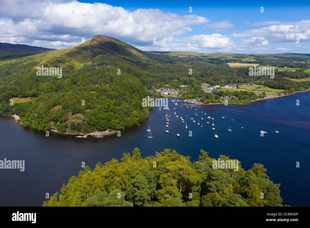 Aerial view of village of Balmaha and Conic Hill on shores of Loch ...