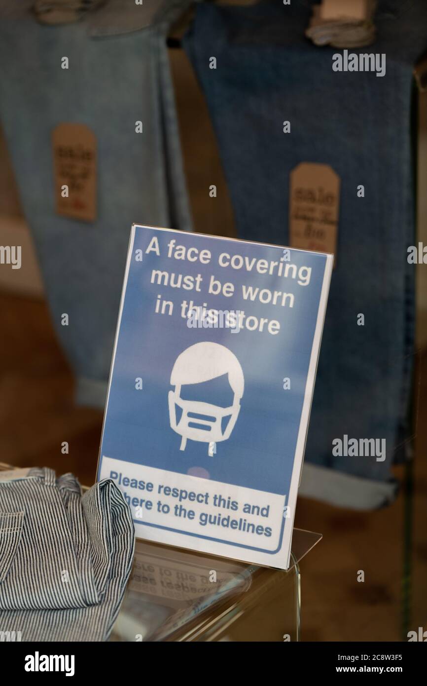 Sign for obligatory mask wearing in a shop window hi-res stock ...