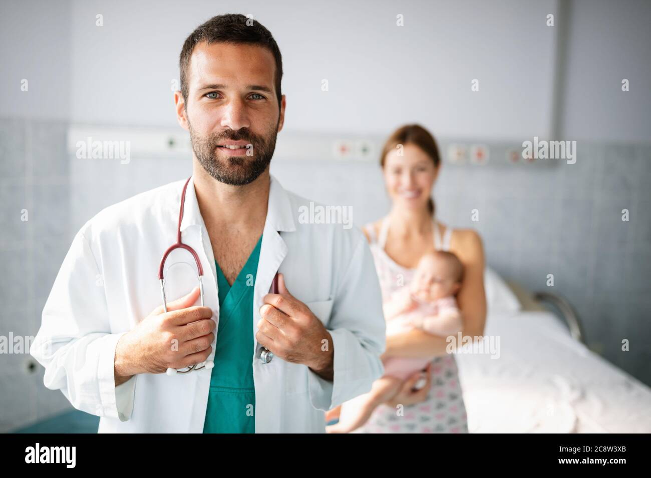 Doctor pediatrician with mother and baby child in clinic. Hospital ...