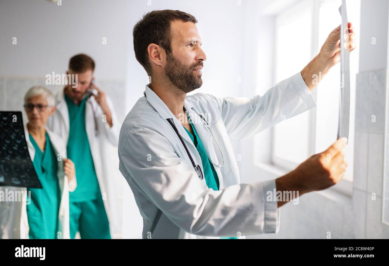 Group of doctors checking x-rays in a hospital Stock Photo - Alamy