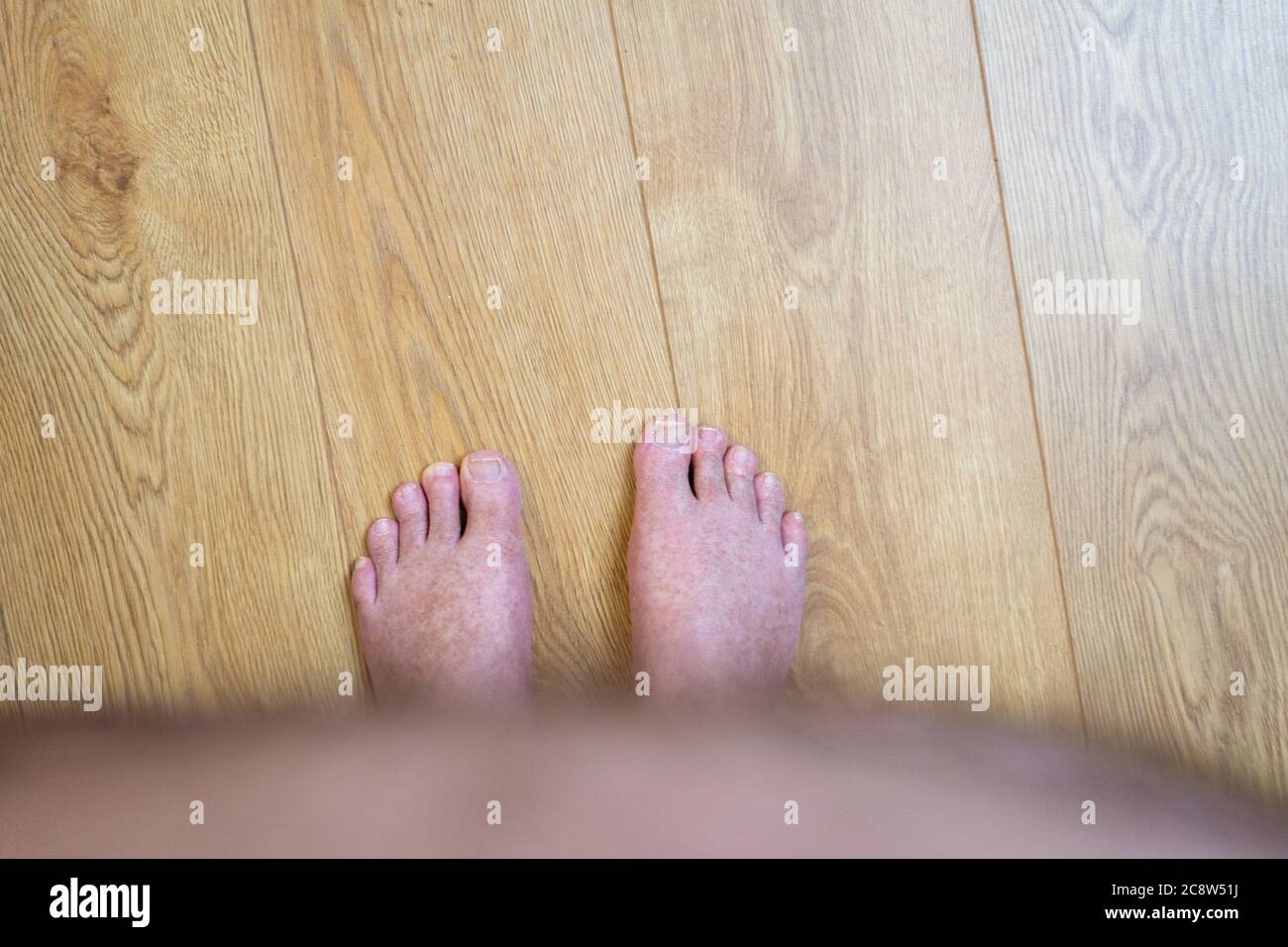 Obese mans point of view looking at his feet Stock Photo - Alamy