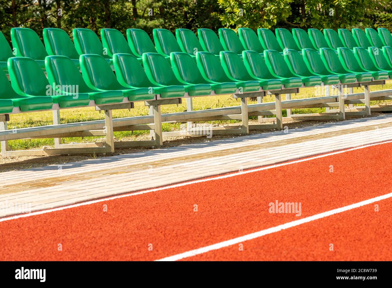 Running track and plastic chairs in a row on sports stadium Stock Photo ...