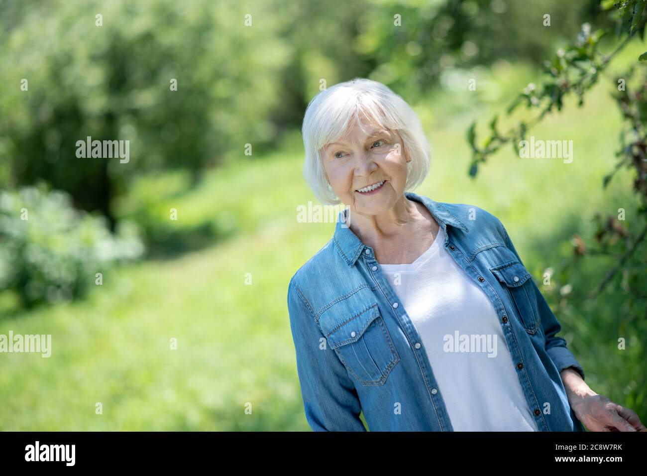 Joyful slim elderly woman hi-res stock photography and images - Alamy