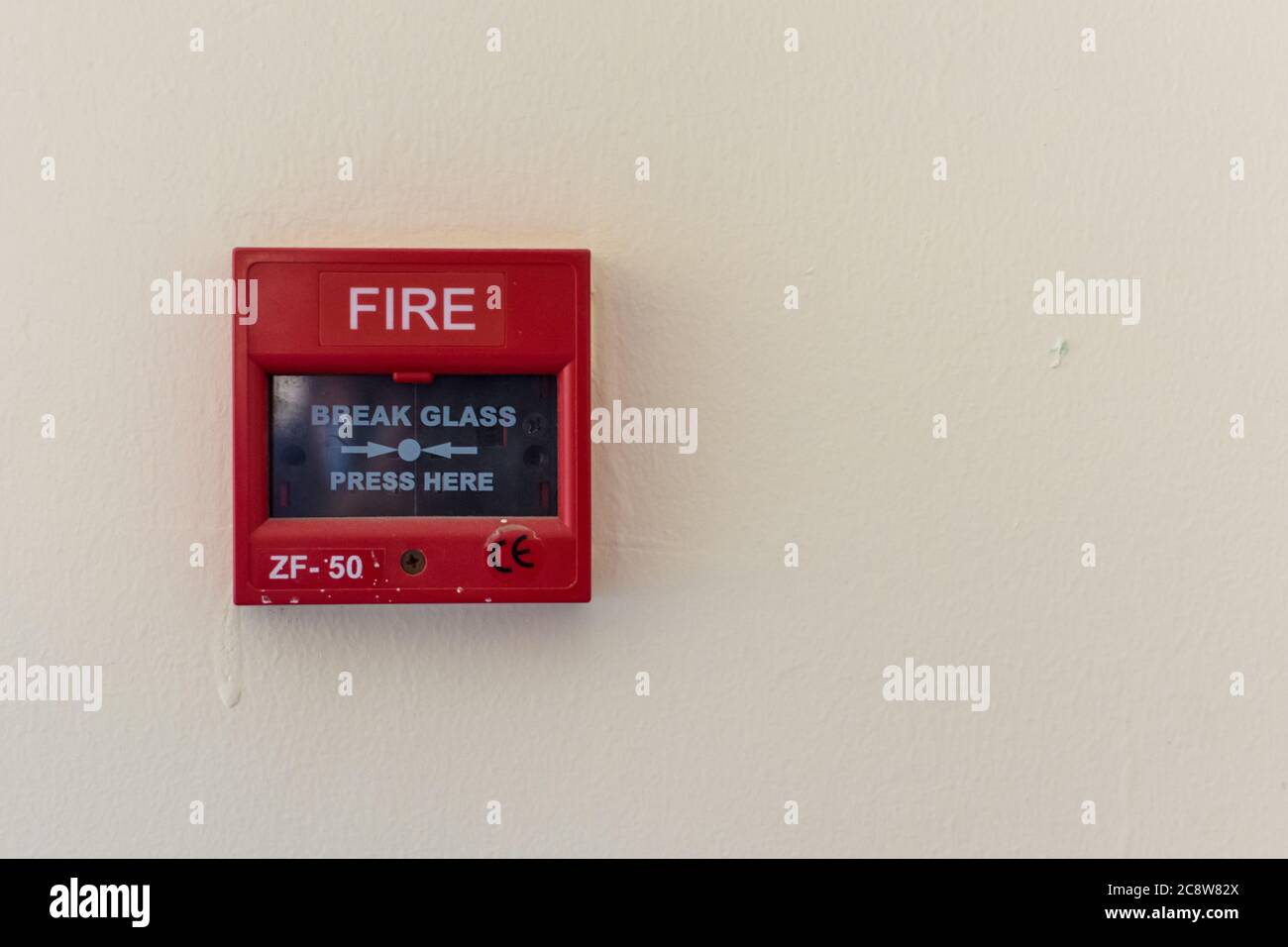 Industrial Fire Emergency Warning System on wall, break glass for ...