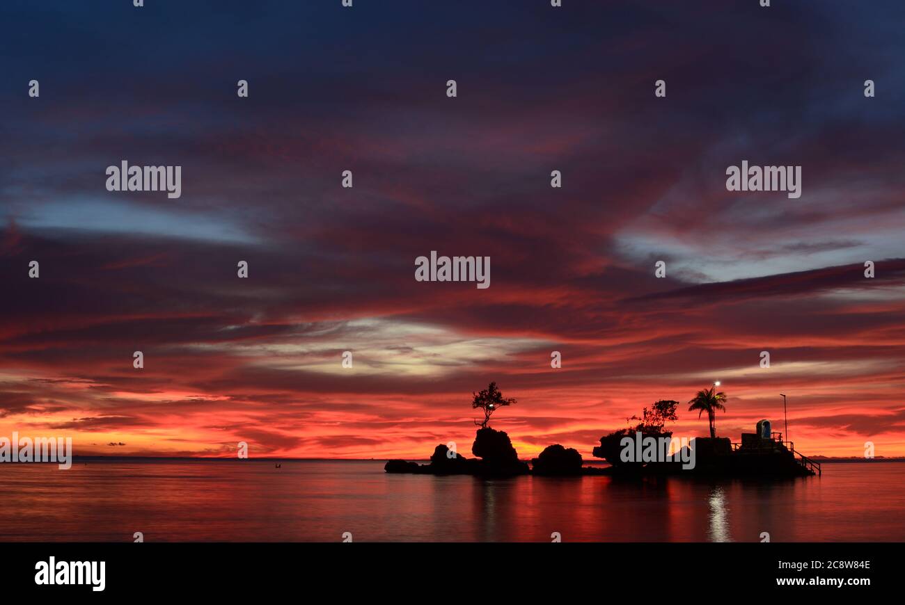 Red sunset at Willy Rock. White Beach. Boracay. Aklan. Western Visayas ...