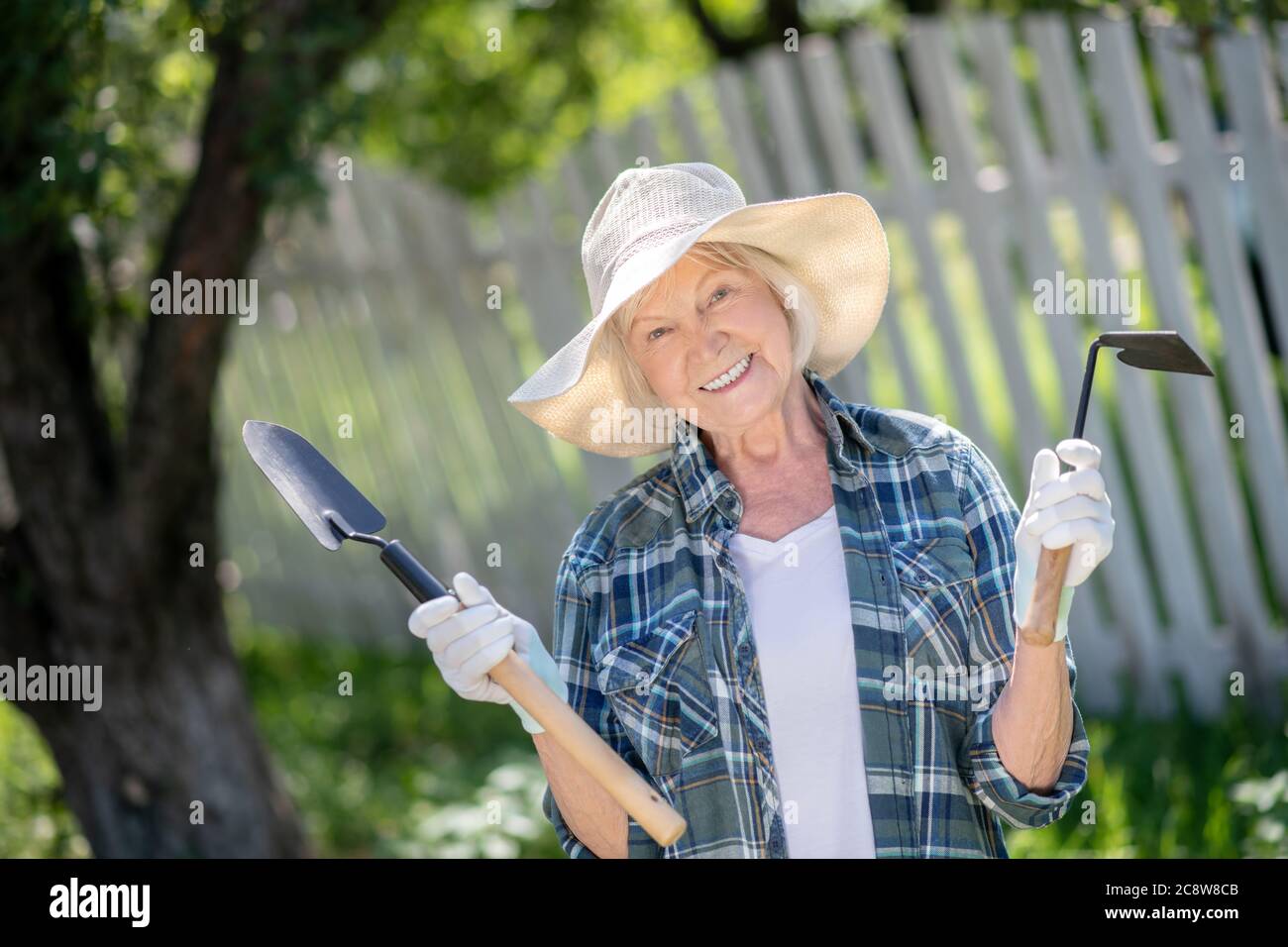 Woman with a hoe hi-res stock photography and images - Alamy