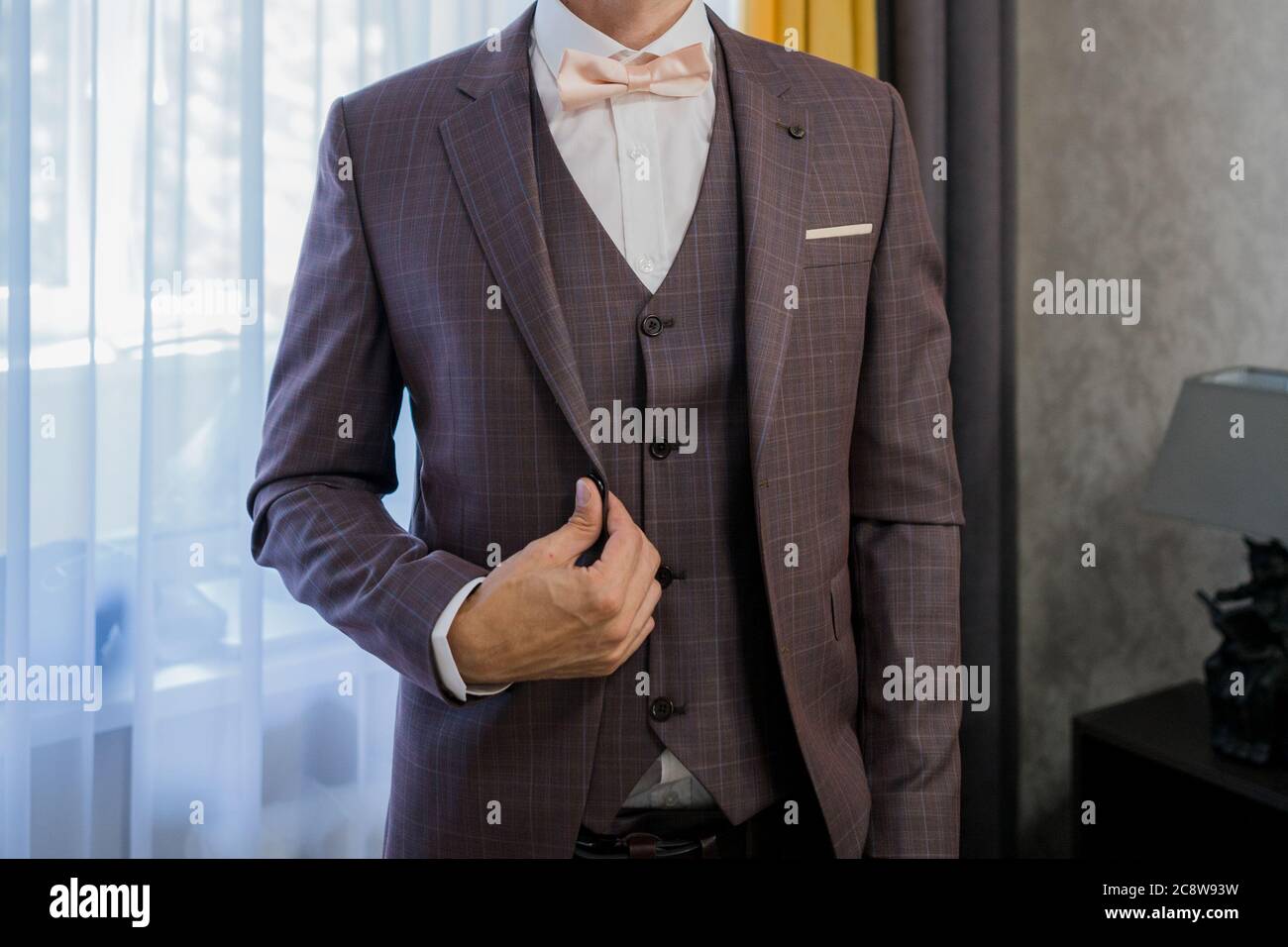 Man puts on suit jacket hi-res stock photography and images - Alamy