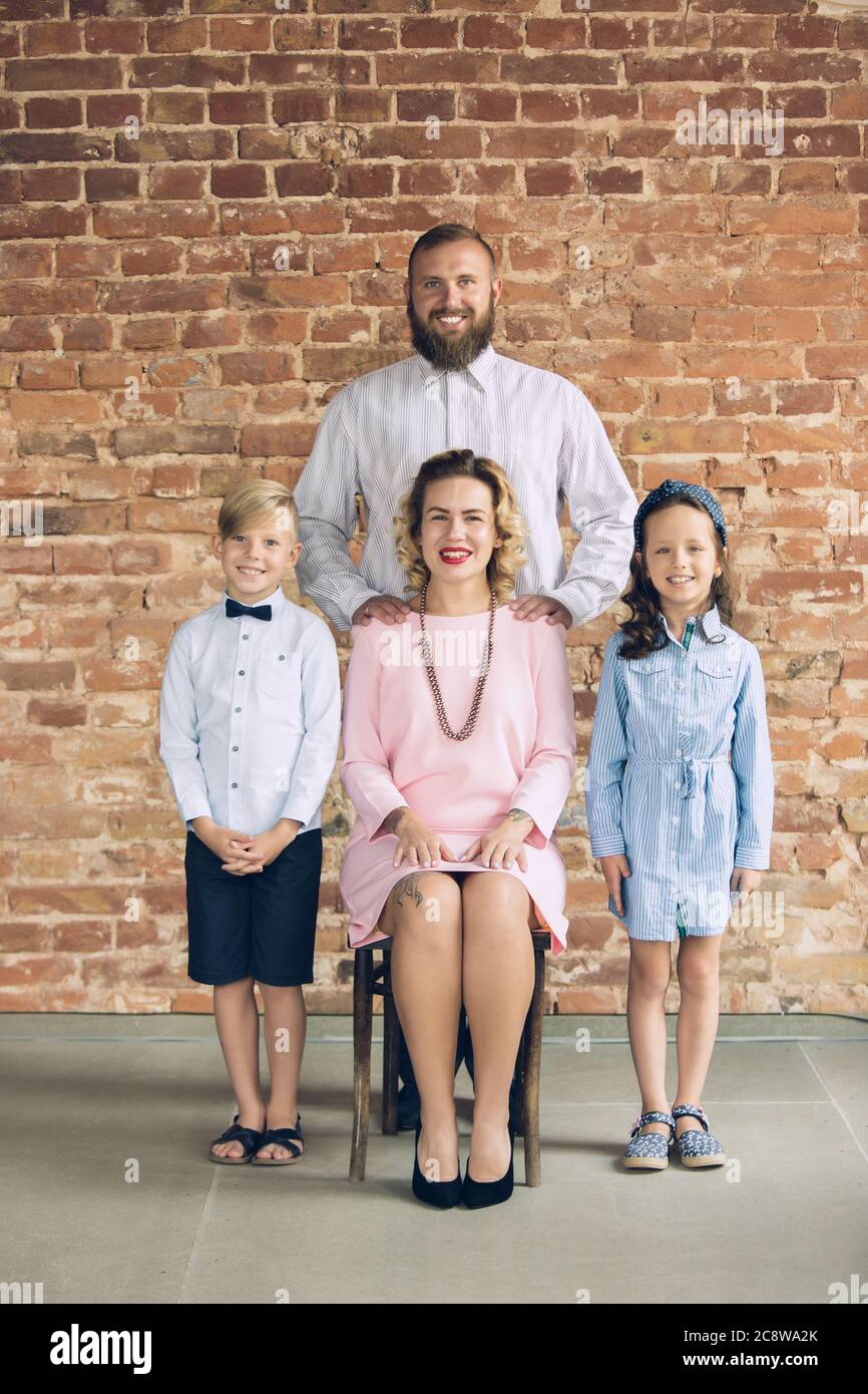 Classic. Happy family traditional portrait, old-fashioned. Cheerful ...
