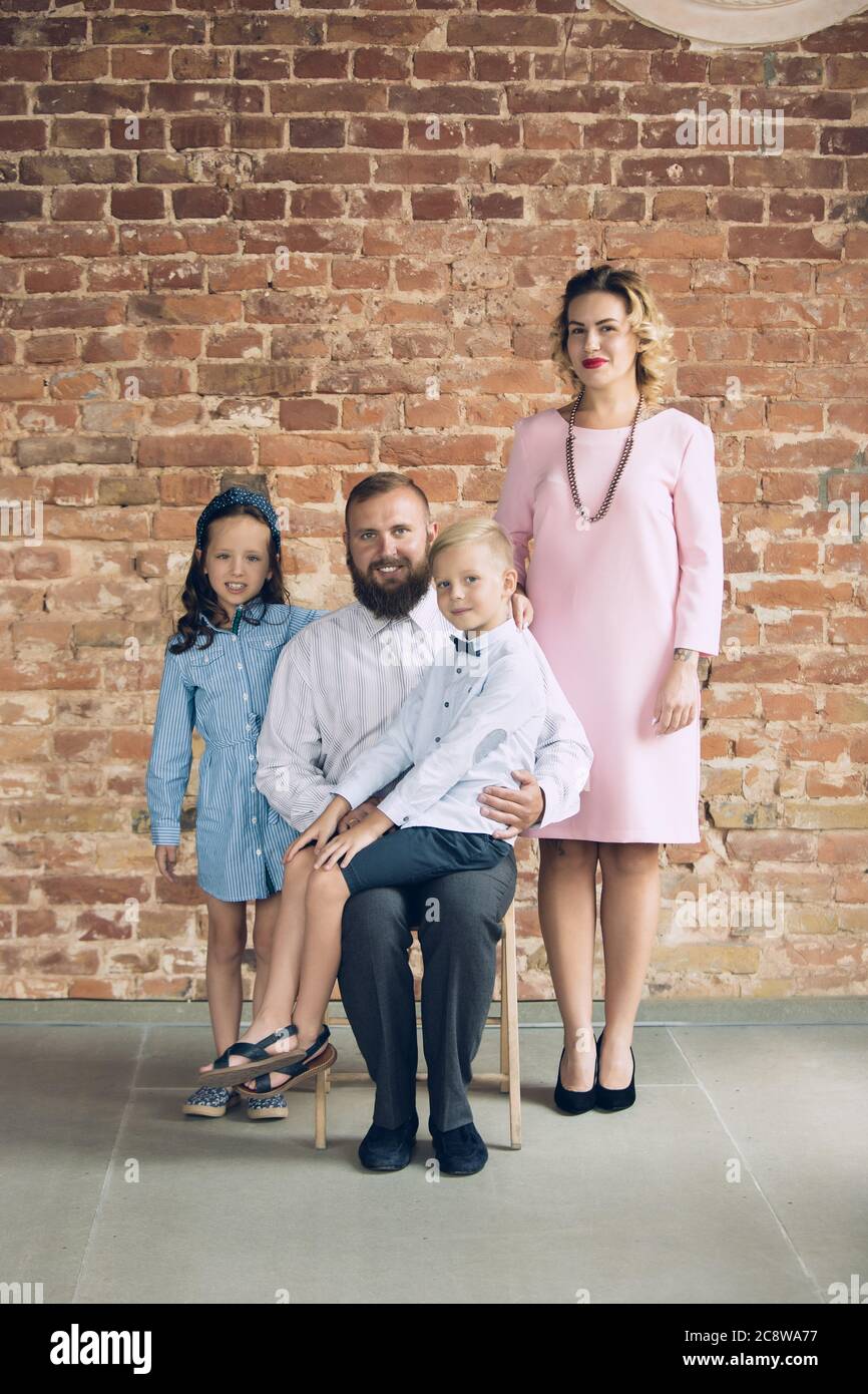 Classic. Happy family traditional portrait, old-fashioned. Cheerful ...