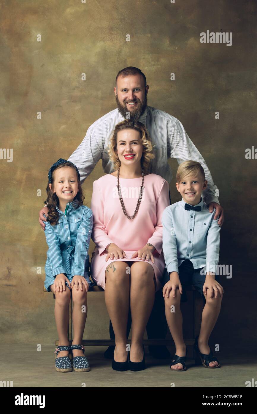 History. Happy family traditional portrait, old-fashioned. Cheerful ...