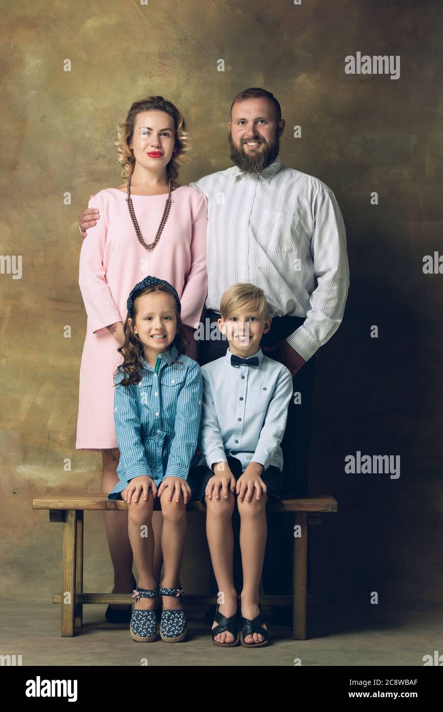 History. Happy family traditional portrait, old-fashioned. Cheerful ...