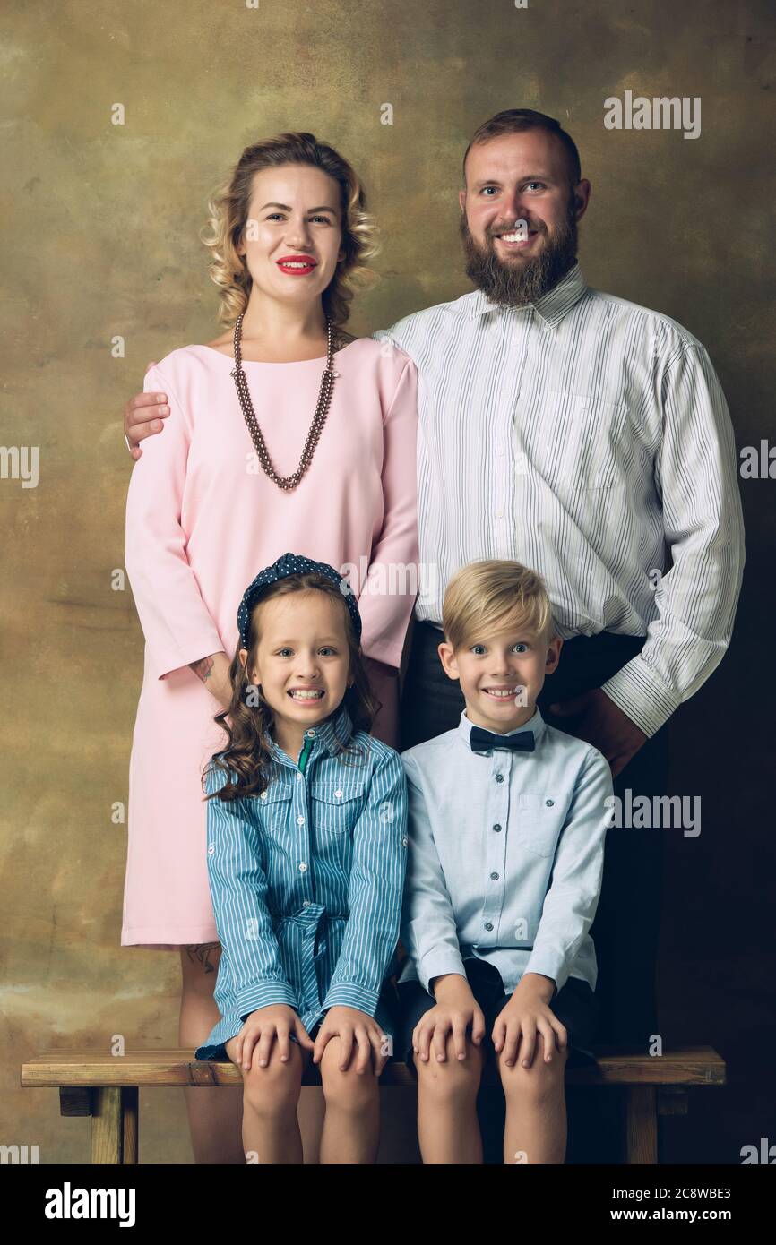 History. Happy family traditional portrait, old-fashioned. Cheerful ...