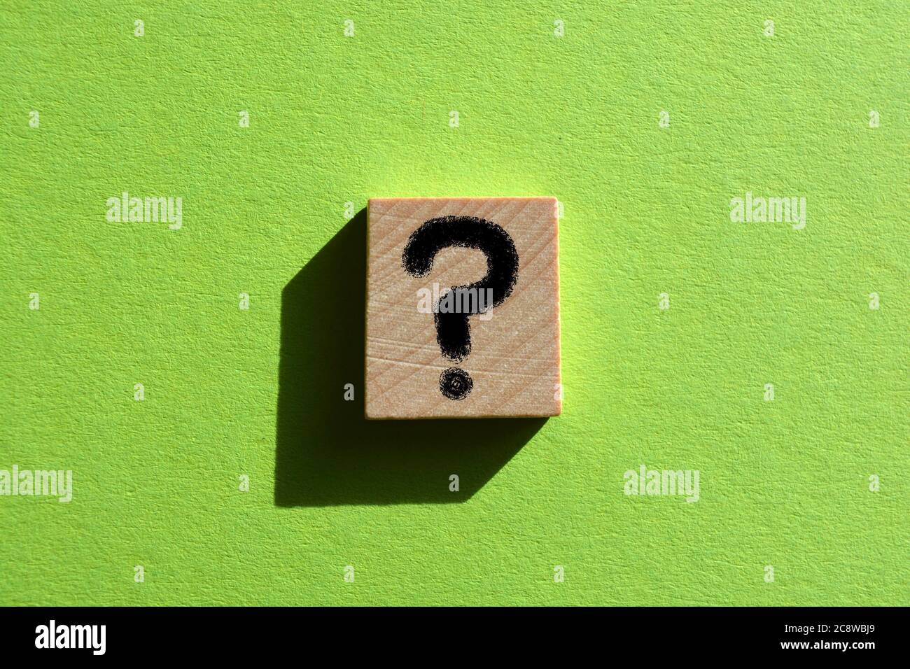 Question mark symbol on wood, isolated on green background Stock Photo ...