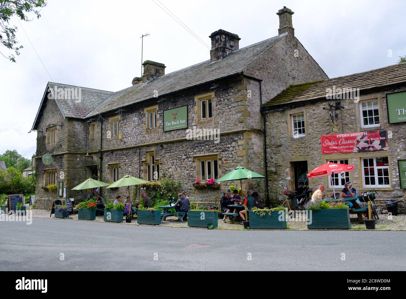 Visitors in the pretty village of Malham in the North Yorkshire Dales ...