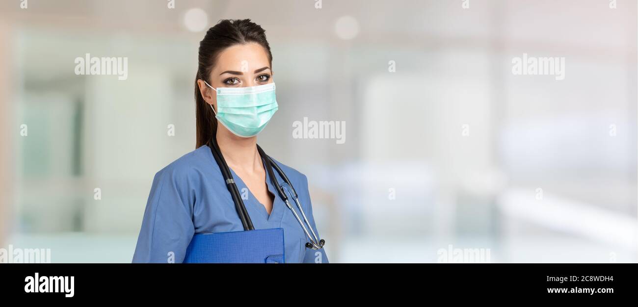 Portrait of a beautiful masked nurse during coronavirus pandemic Stock ...