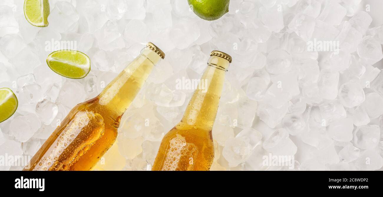 Chilled drink for summer heat. Glass bottles with light beer without ...