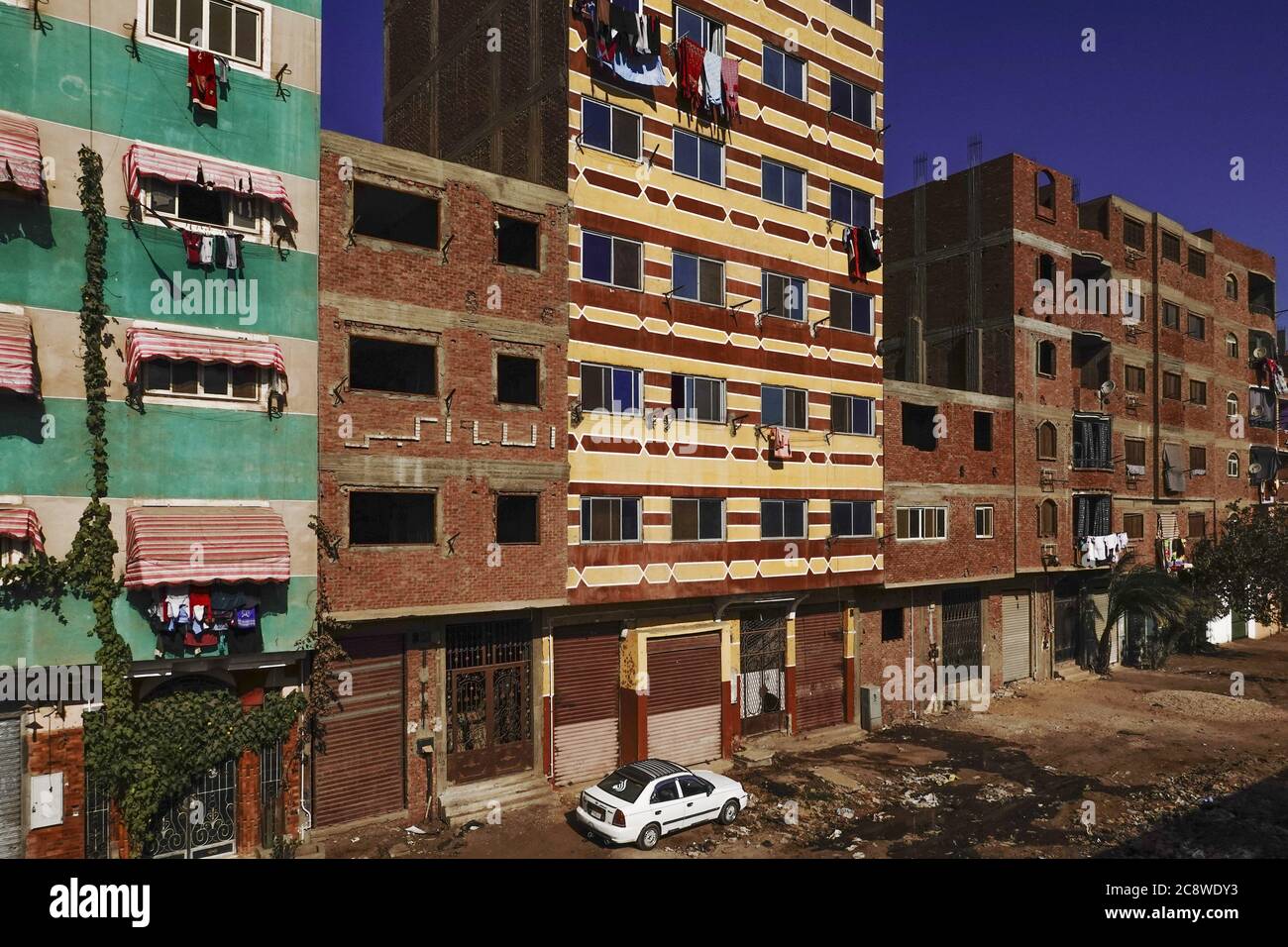 Cairo, Egypt A row of unfinished apartment buildings in the suburbs ...