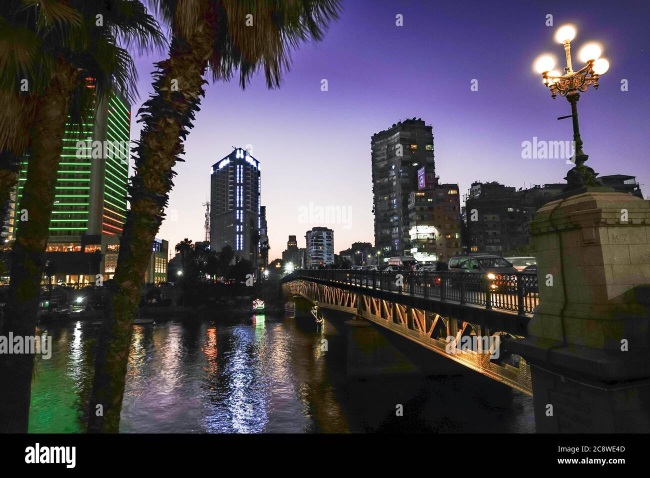 Cairo, Egypt Downtown Cairo, the Nile River at night and the El-Galaa ...
