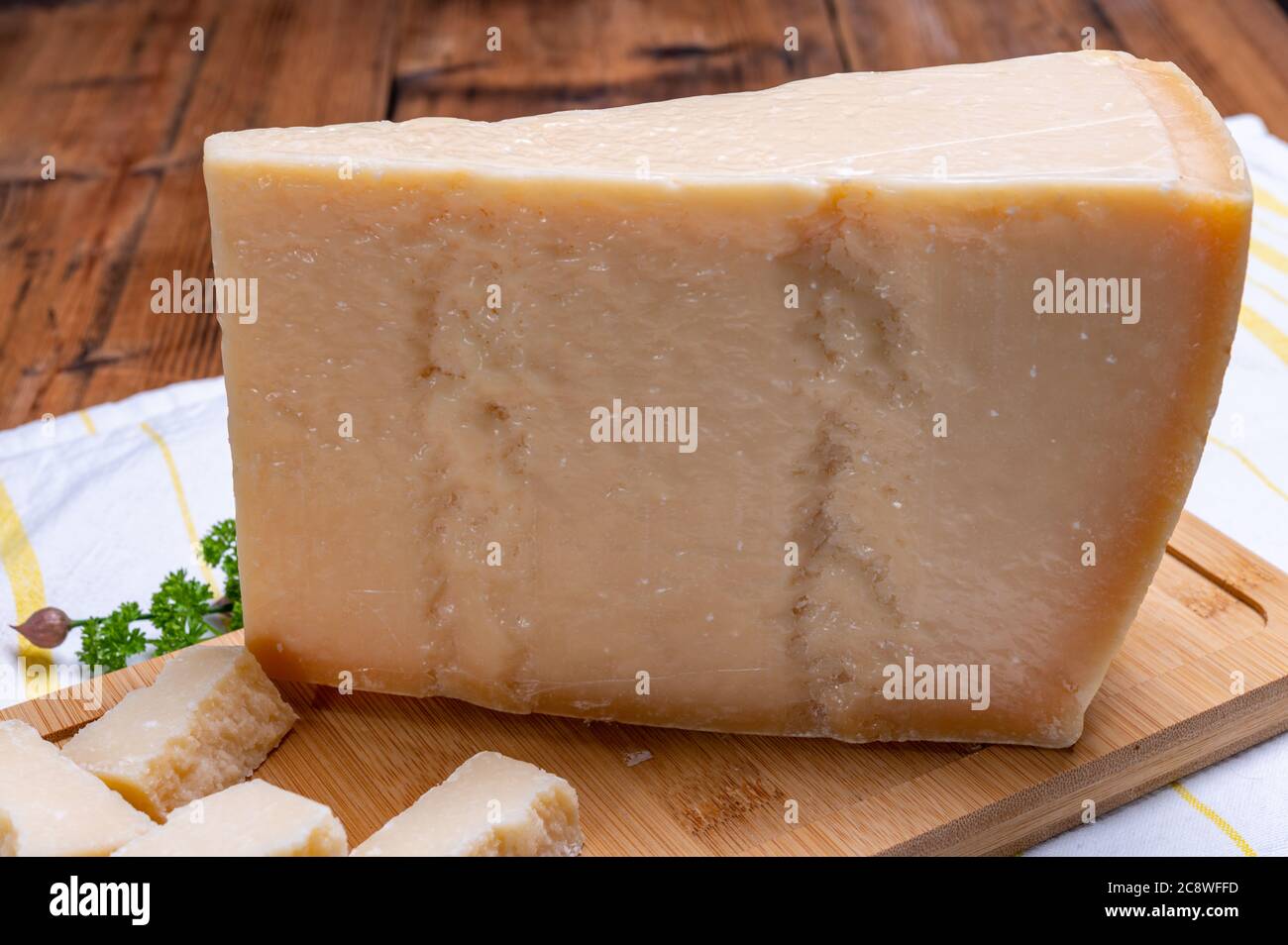 Big wedge of parmigiano-reggiano parmesan hard Italian cheese made from ...