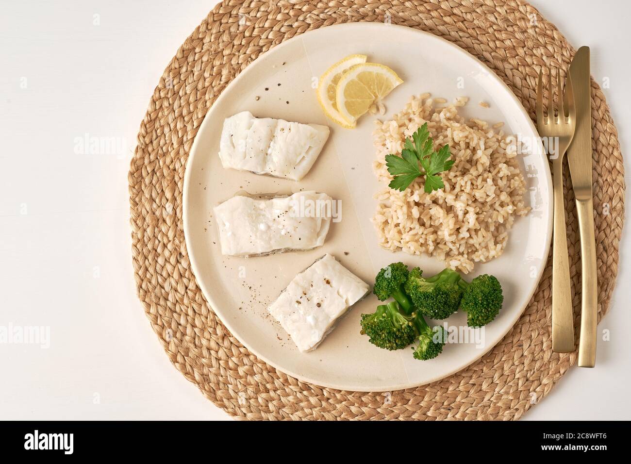 Steamed cod with brown rice and vegetables, dash fodmap diet top view ...